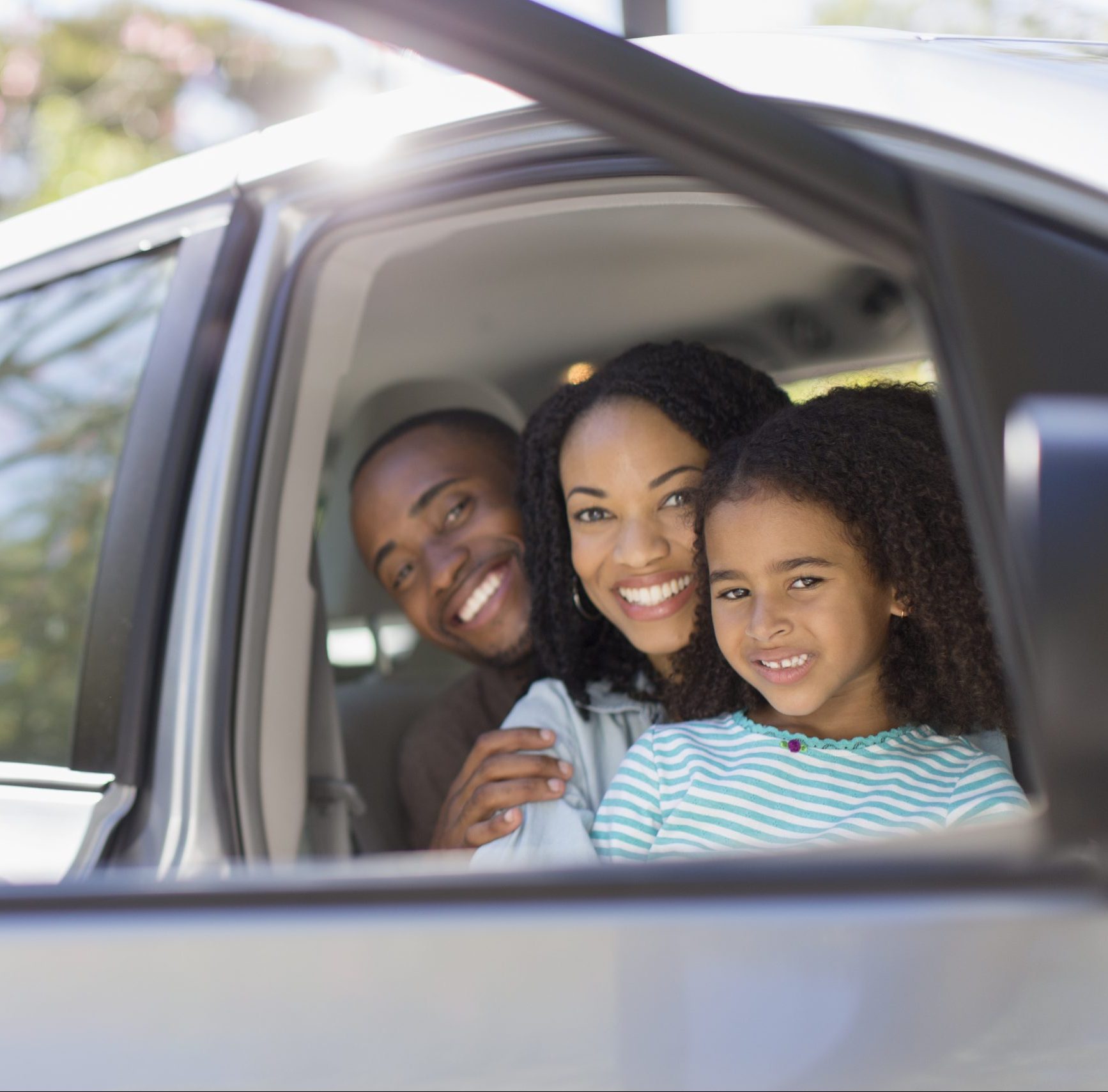 Portrait happy family inside car